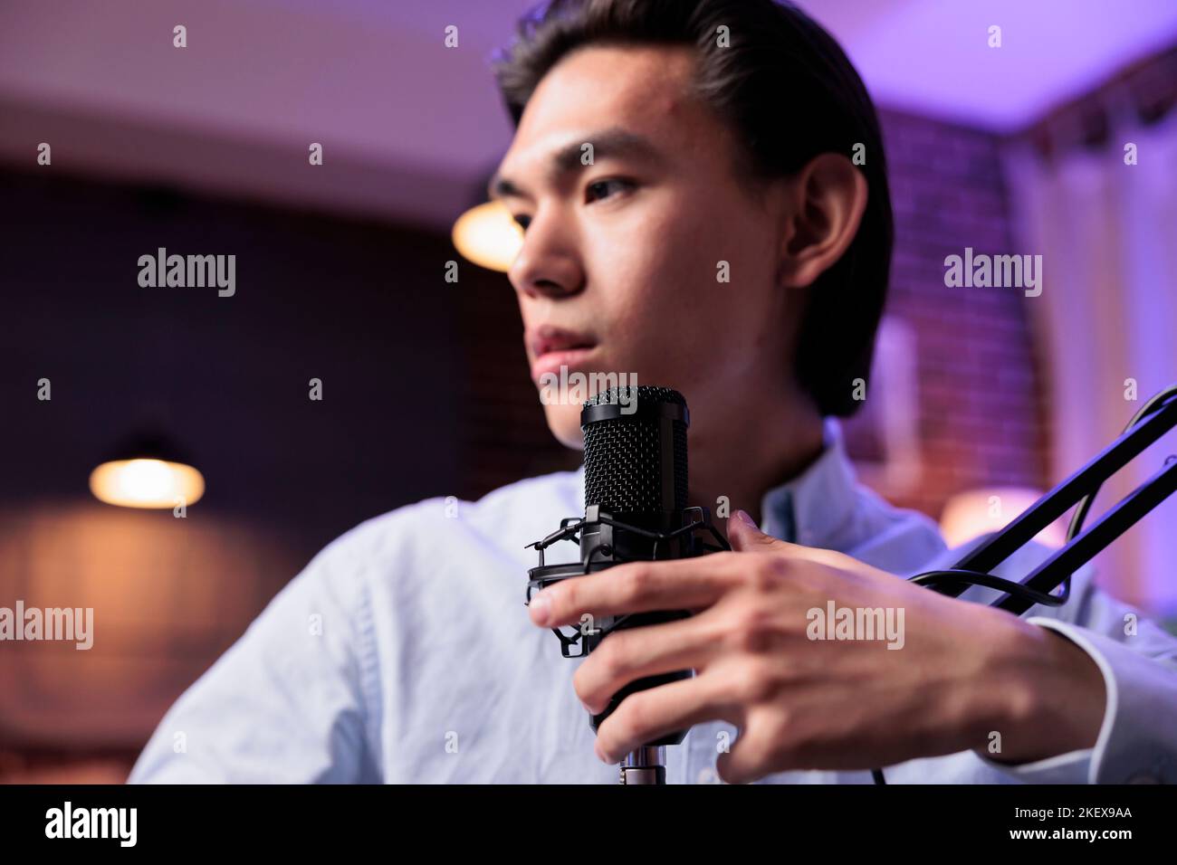 Asian influencer recording live show with microphone, broadcasting ...