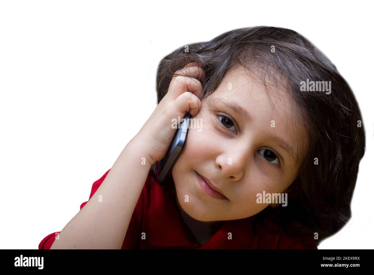 boy holding a mobile phone isolated on a white background. Cute happy ...