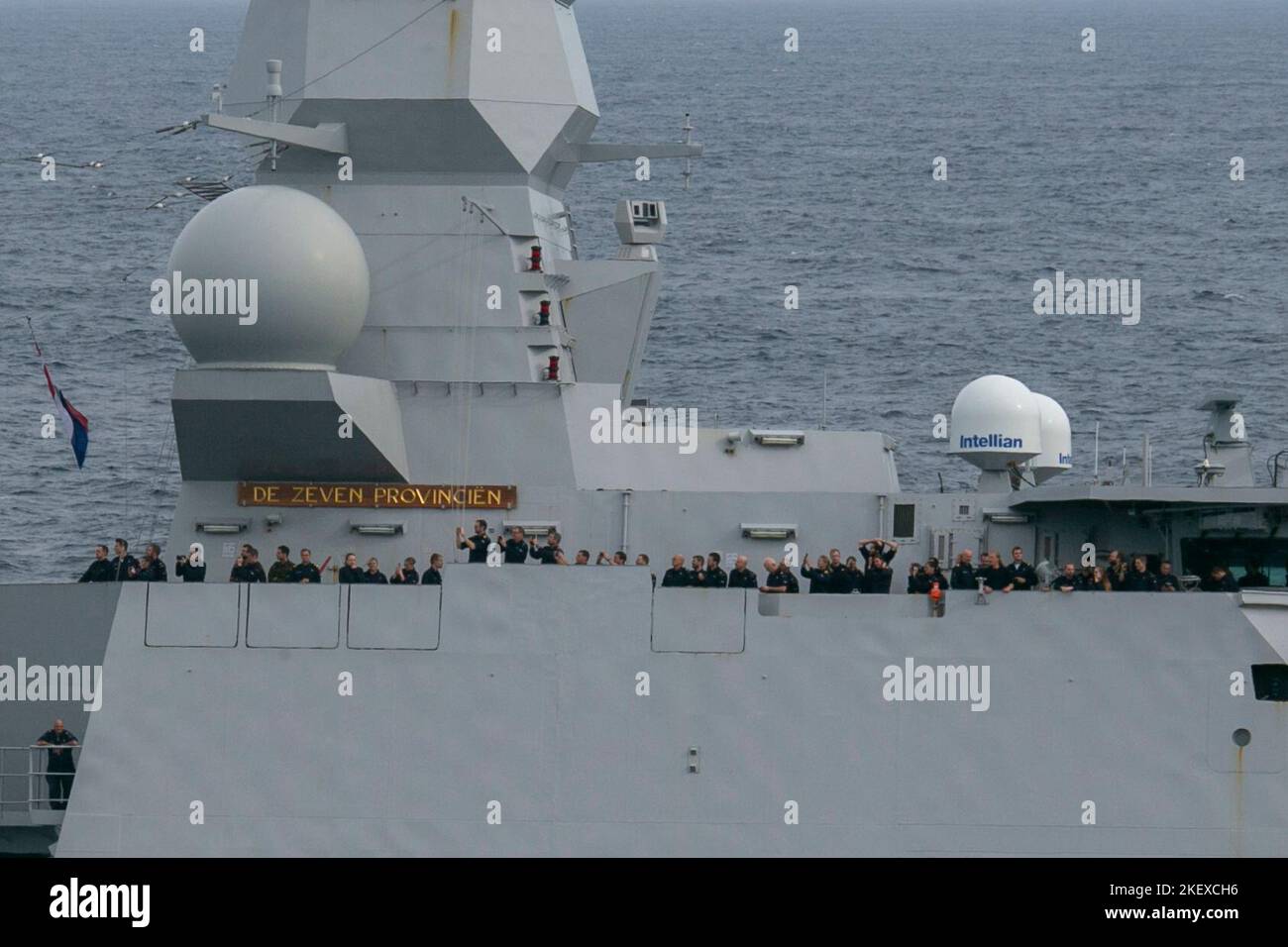 Sailors onboard Dutch frigate HNLMS De Zeven Provincien (F 802) observe ...