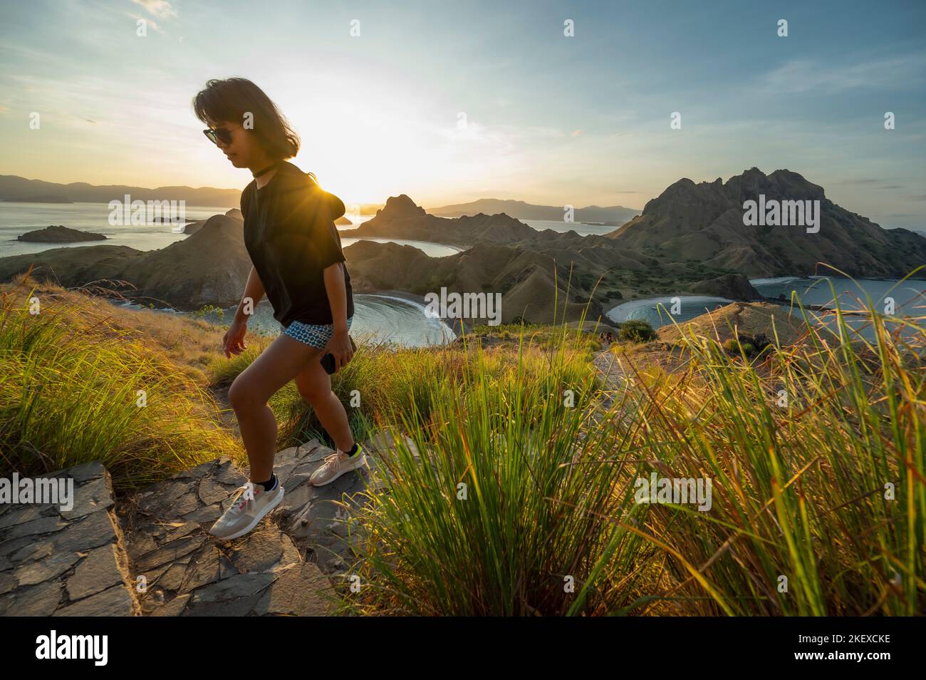 woman hiking up east Nusa Tenggara island in Komodo Stock Photo - Alamy