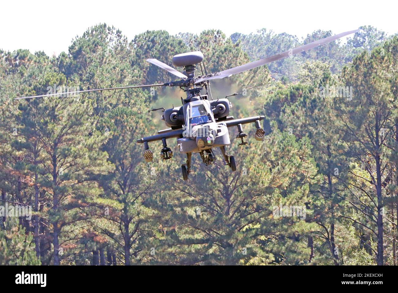 An AH-64E Apache Guardian helicopter conducts nap of the earth flight ...