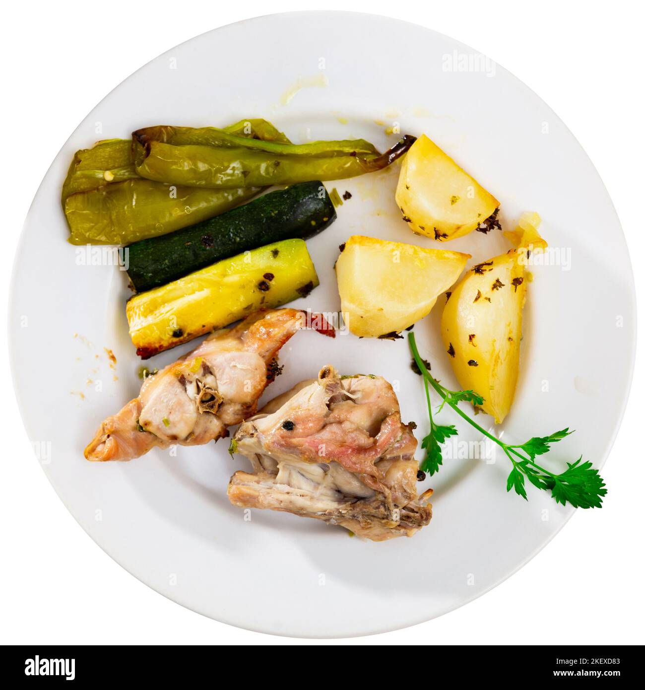 Roasted rabbit served with vegetable garnish Stock Photo - Alamy