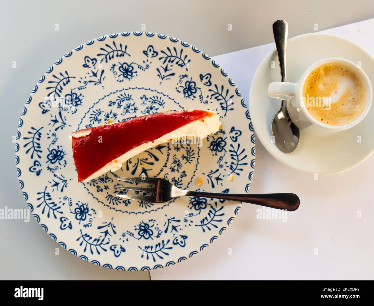 Slice of cheesecake decorated with currant jelly Stock Photo - Alamy