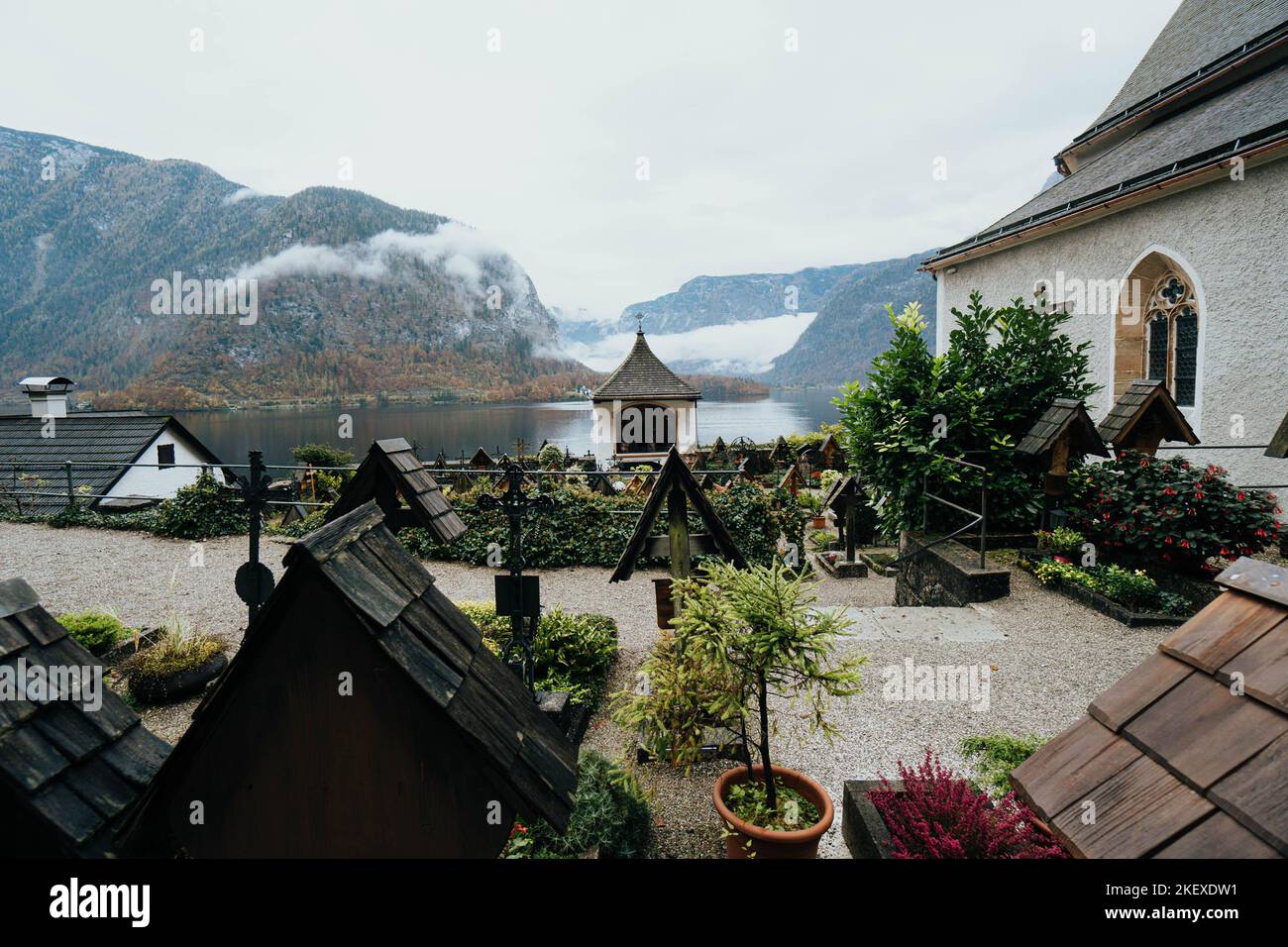 hallstatt cemetery against lake and mountains Stock Photo - Alamy