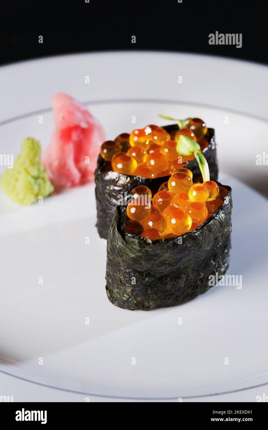 Salmon roe maki Sushi on luxury plate Stock Photo - Alamy