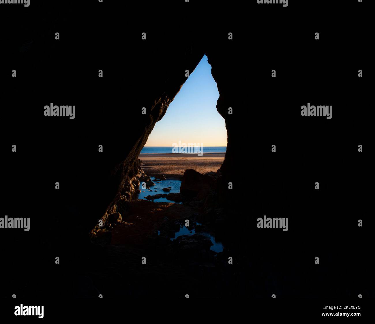 Dark cave in a sandy rock hi-res stock photography and images - Alamy