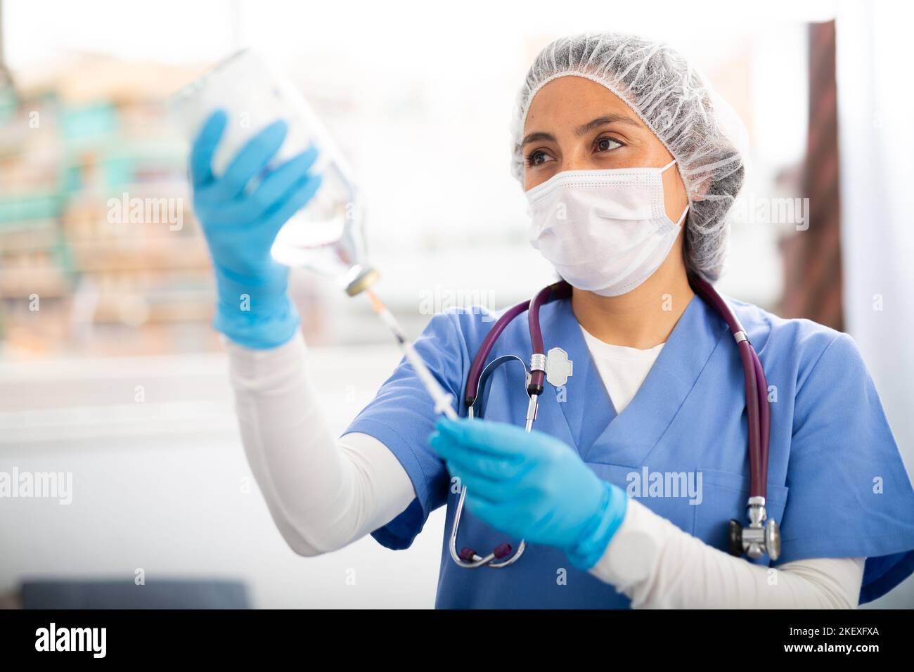 Professional nurse woman making injection in hospital Stock Photo - Alamy