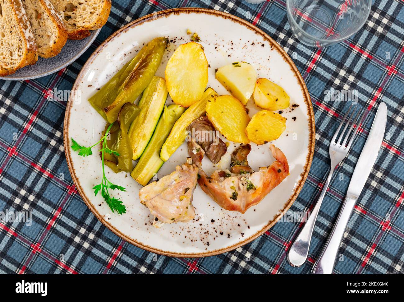 Roasted rabbit served with vegetable garnish Stock Photo - Alamy