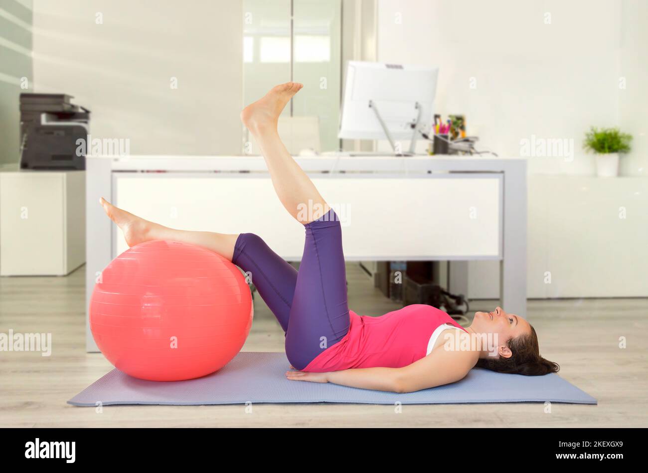 Female office using exercise ball hi-res stock photography and images ...