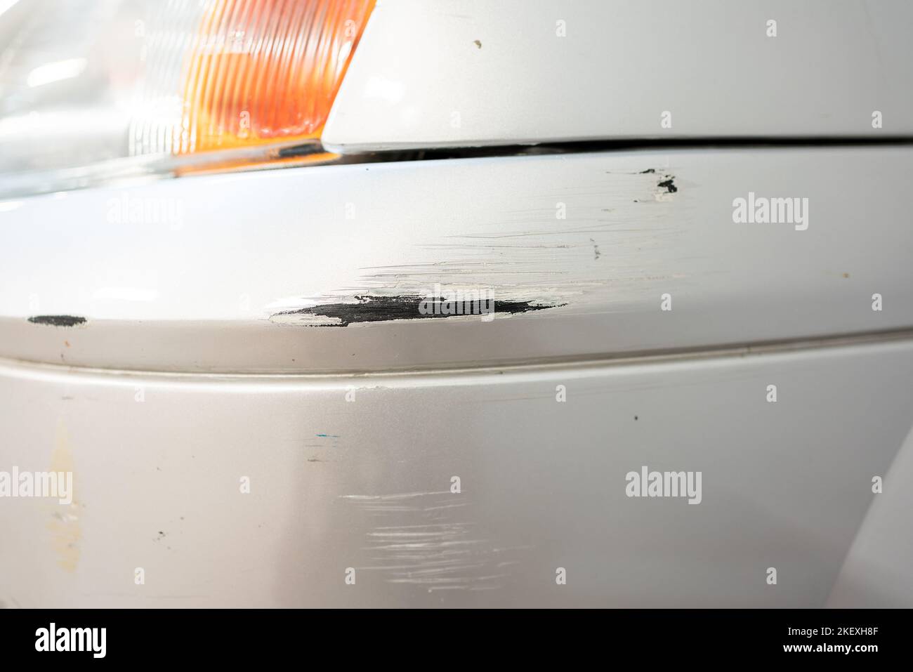 Close up of gray scratched car with damaged paint in crash accident ...