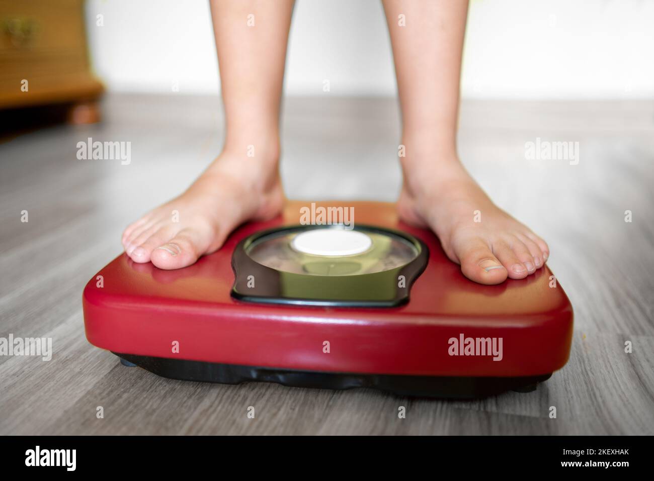 Closeup view of scales on a floor and kids feet at room Stock Photo - Alamy