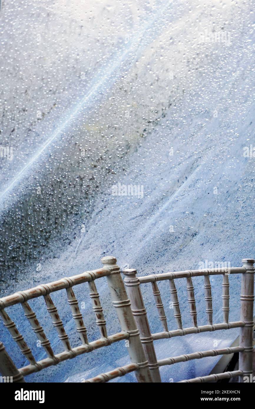 chairs in wedding marquee with rain outside Stock Photo - Alamy
