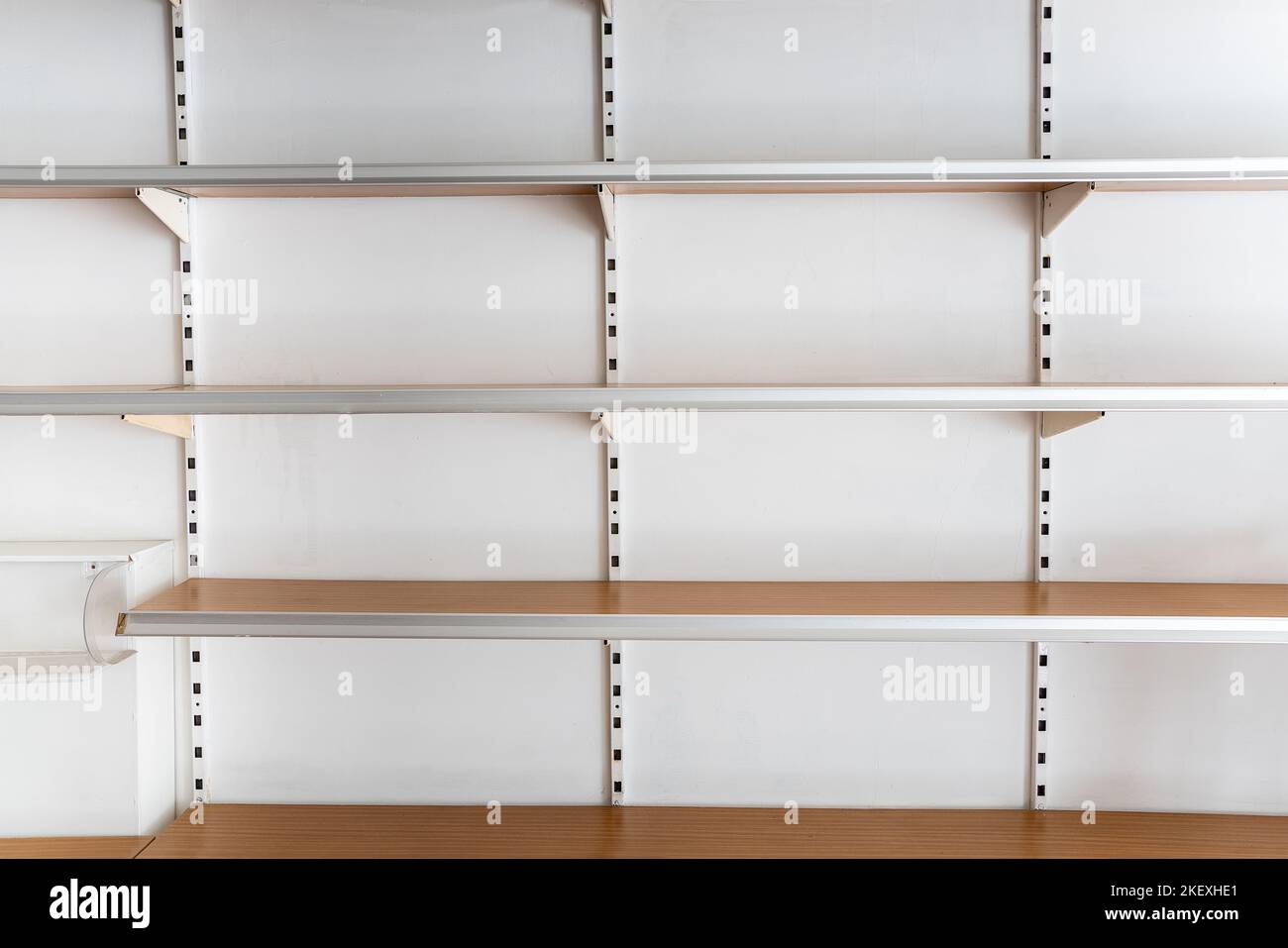 Supermarket empty shelves from front on white background Stock Photo ...