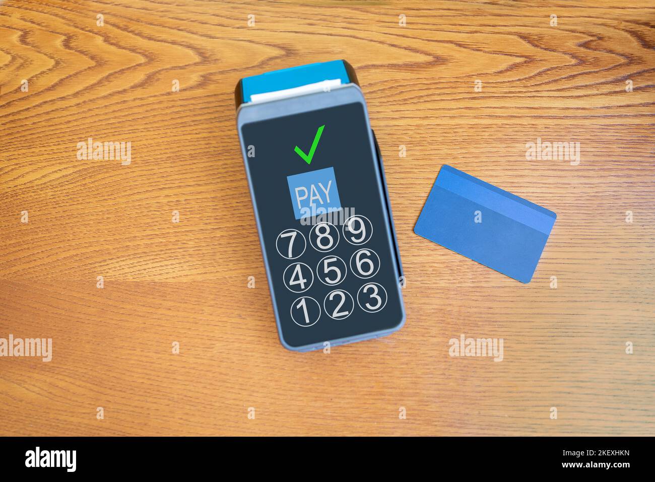 Top view of modern terminal for contactless and wireless goods payment ...