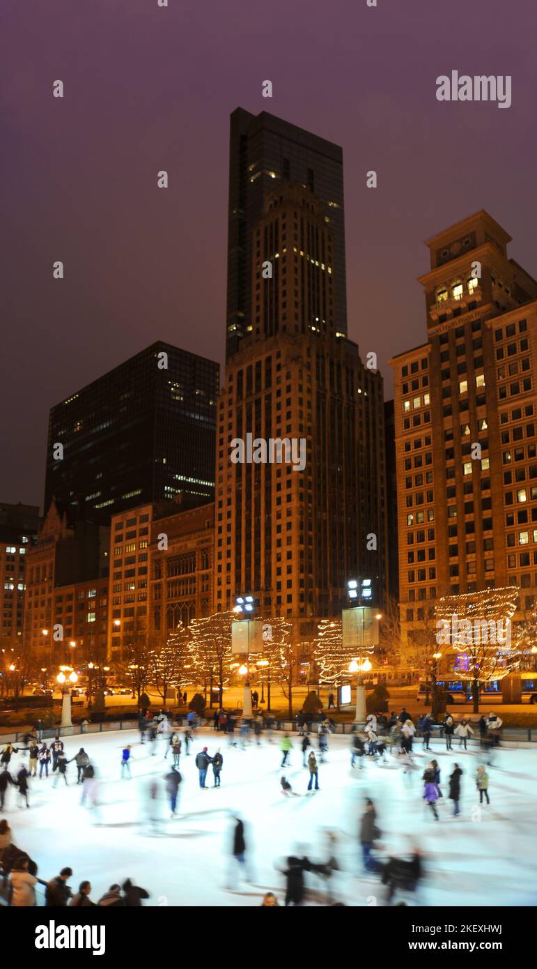 Chicago with Ice-skating at the park in front of skyscrapers and ...