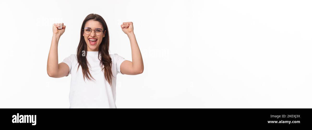 Waist-up portrait of talented attractive girl winning in competition ...