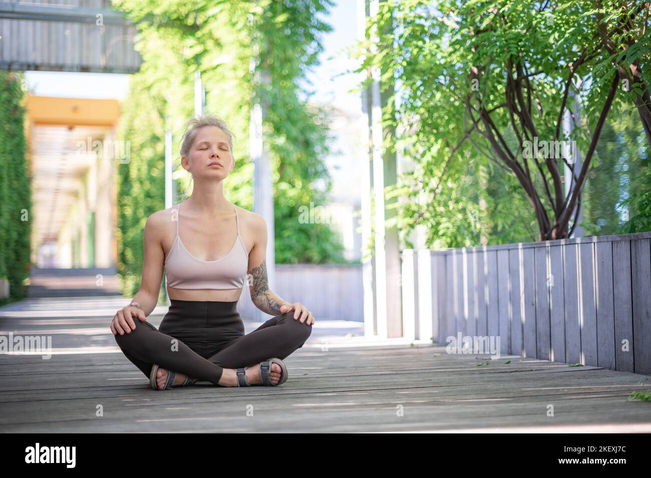 Girl practice yoga meditation outdoor in park Stock Photo - Alamy