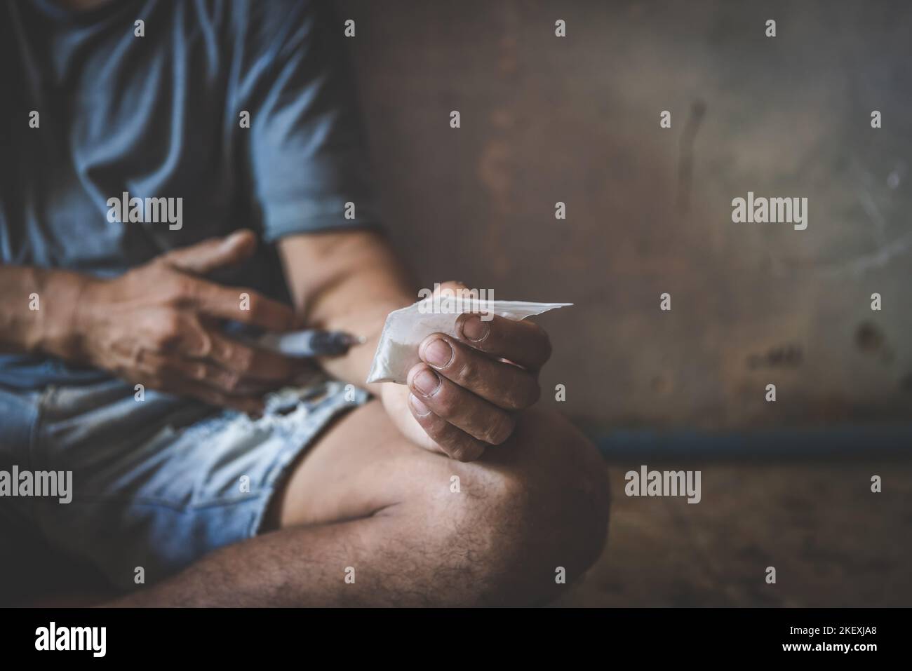 Drug addict's hands injecting heroin into his arm, Heroin addict in the ...