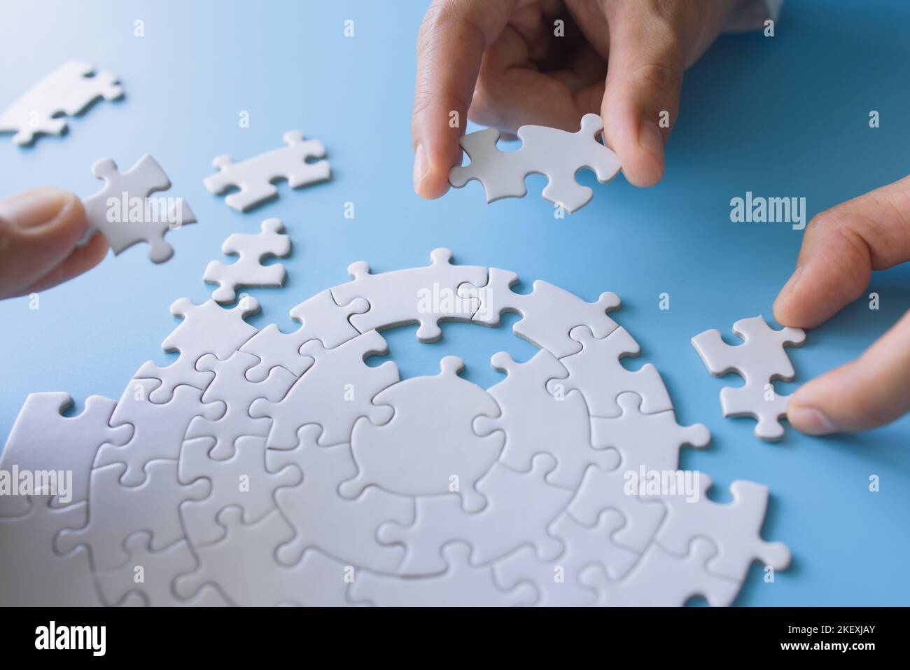 Hand businessman connecting jigsaw hi-res stock photography and images ...