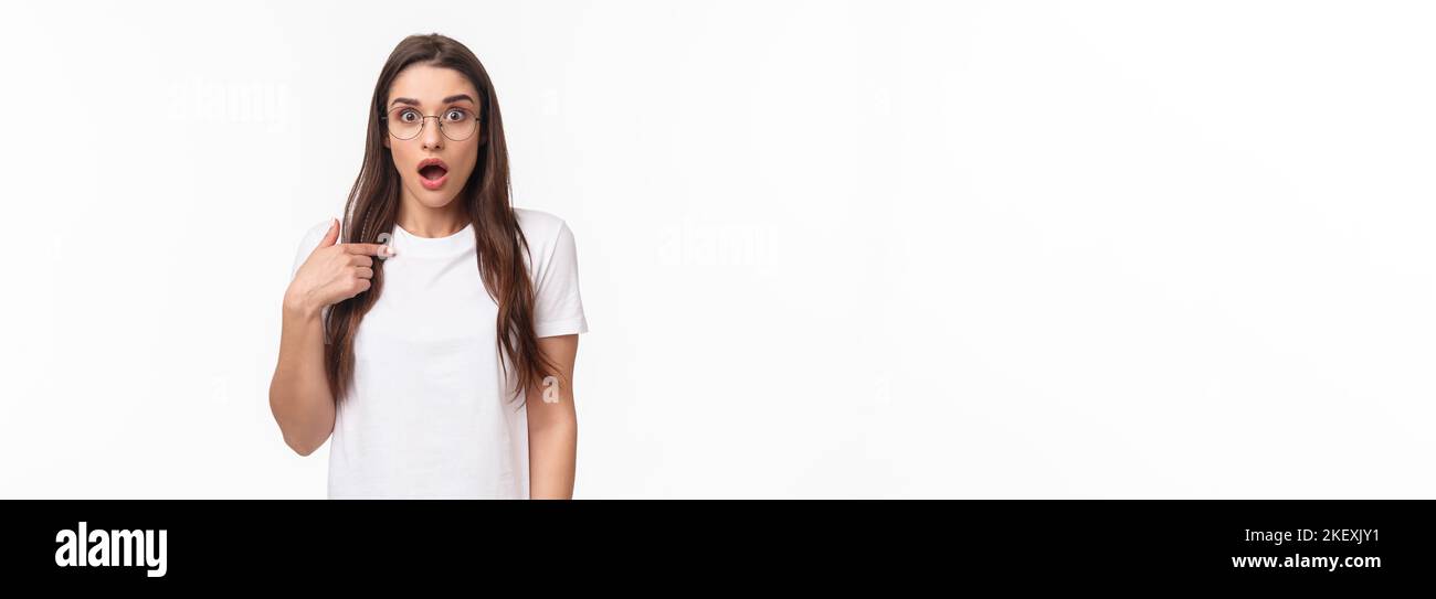 Portrait of surprised, startled young brunette female 20s in glasses ...
