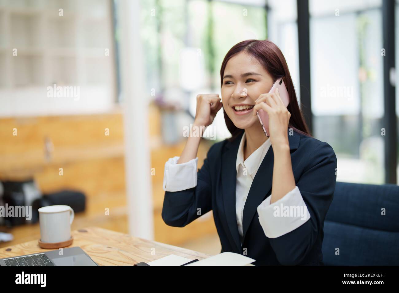 Businessmen use the smart phone to contact partners, success concept ...