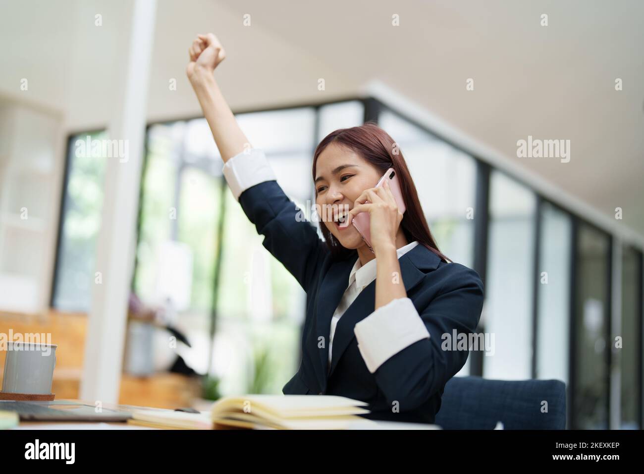 Businessmen use the smart phone to contact partners, success concept ...