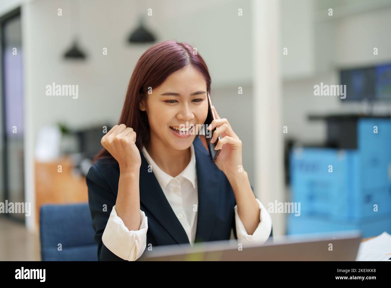 Businessmen use the smart phone to contact partners, success concept ...