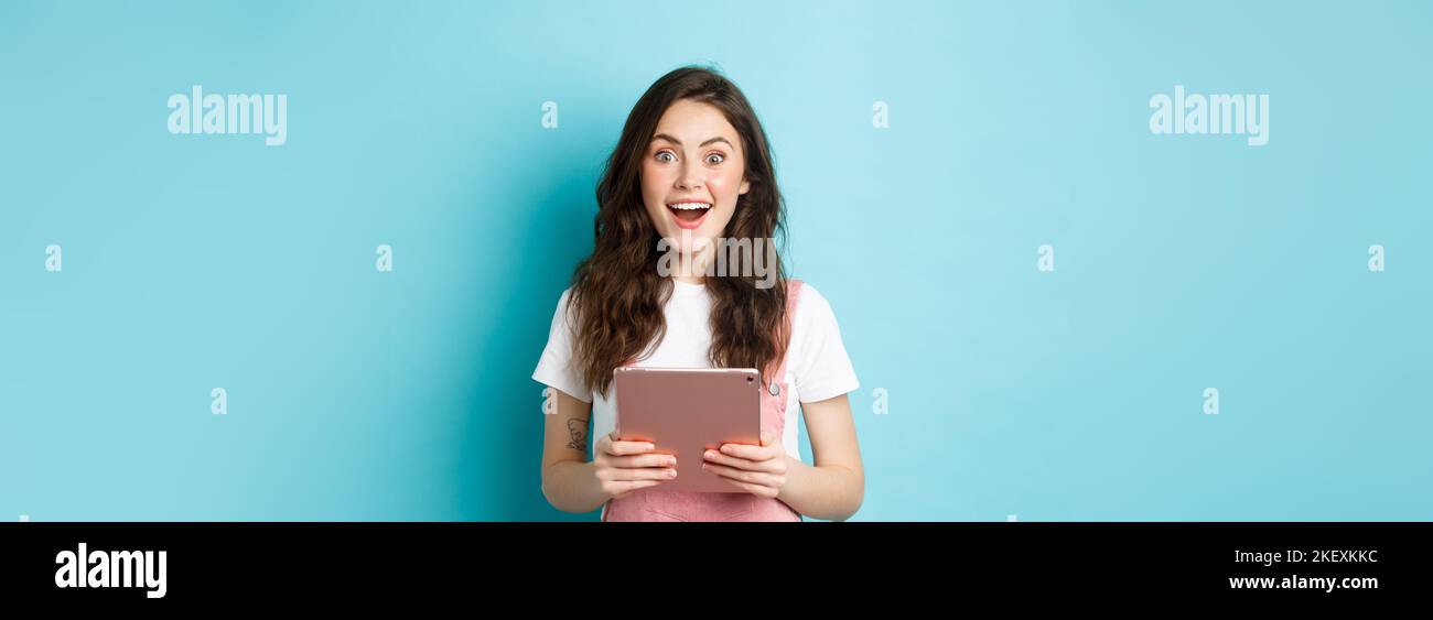 Surprised happy woman stare at camera amazed, hear amazing news ...