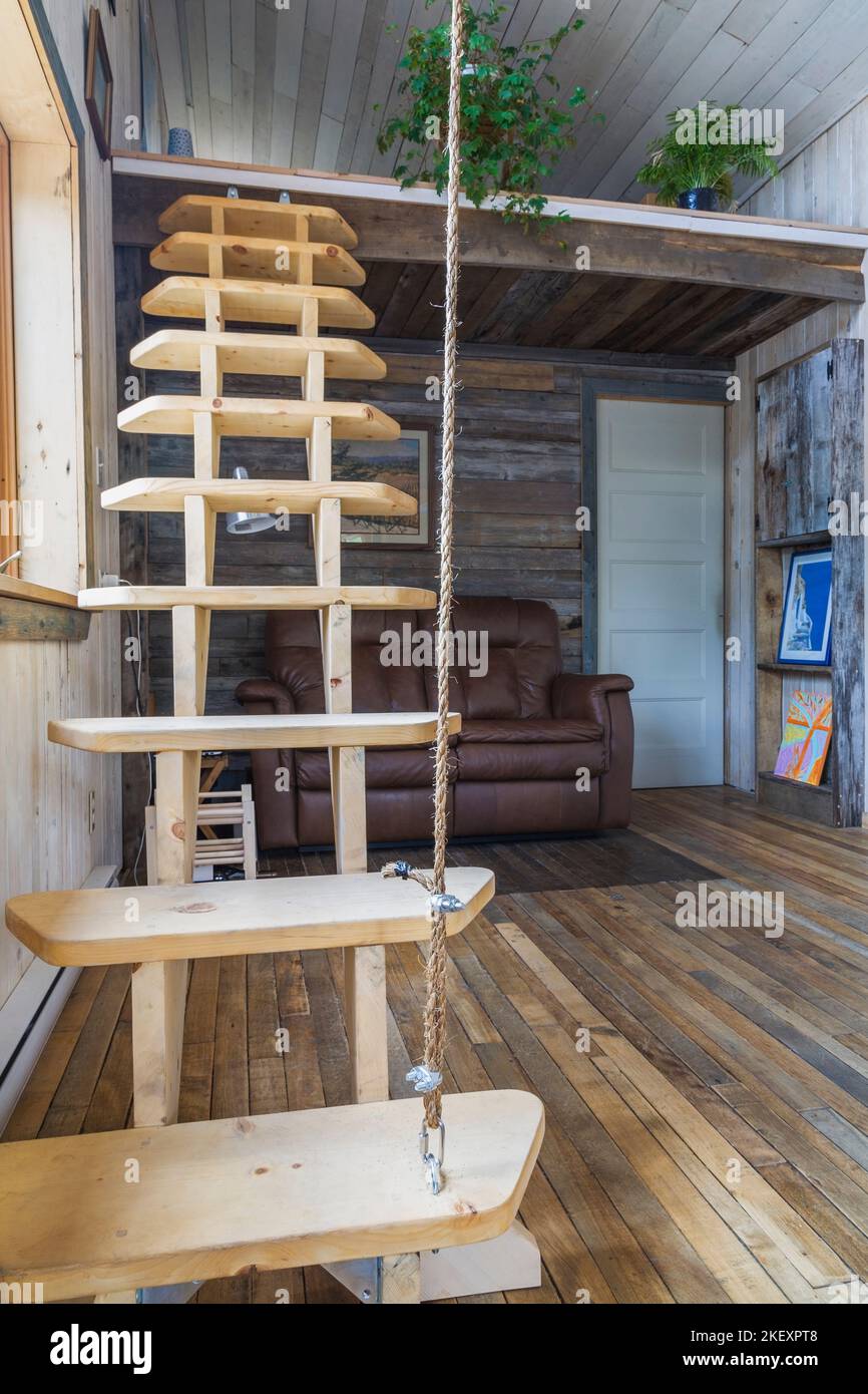 Retractable pinewood stairs leading to bedroom and living room area ...