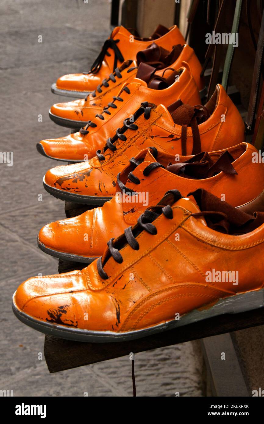 Brown men's shoes with black shoe laces, advertisement for hand made ...