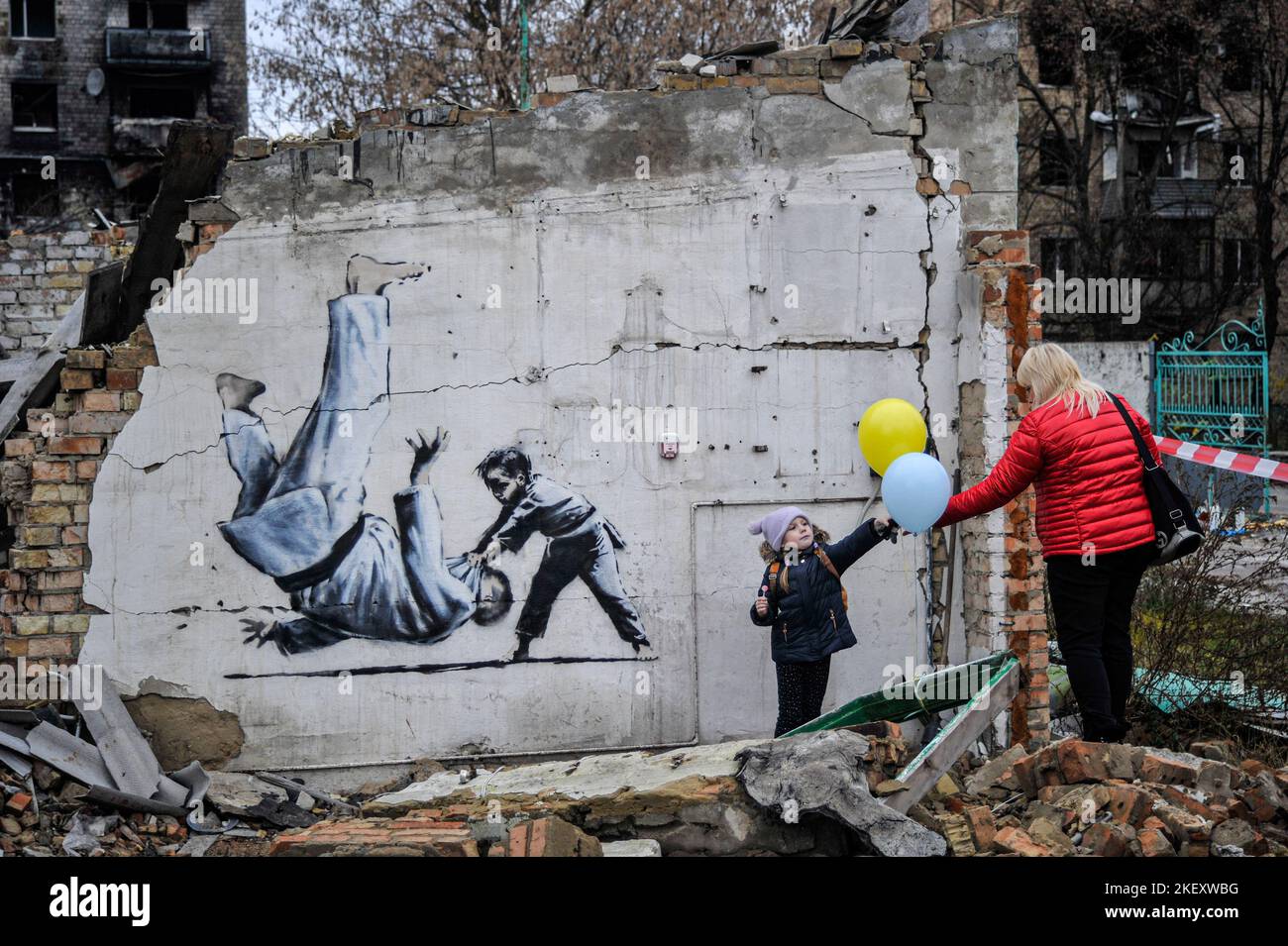 Borodyanka, Ukraine. 14th Nov, 2022. People look at the graffiti made ...