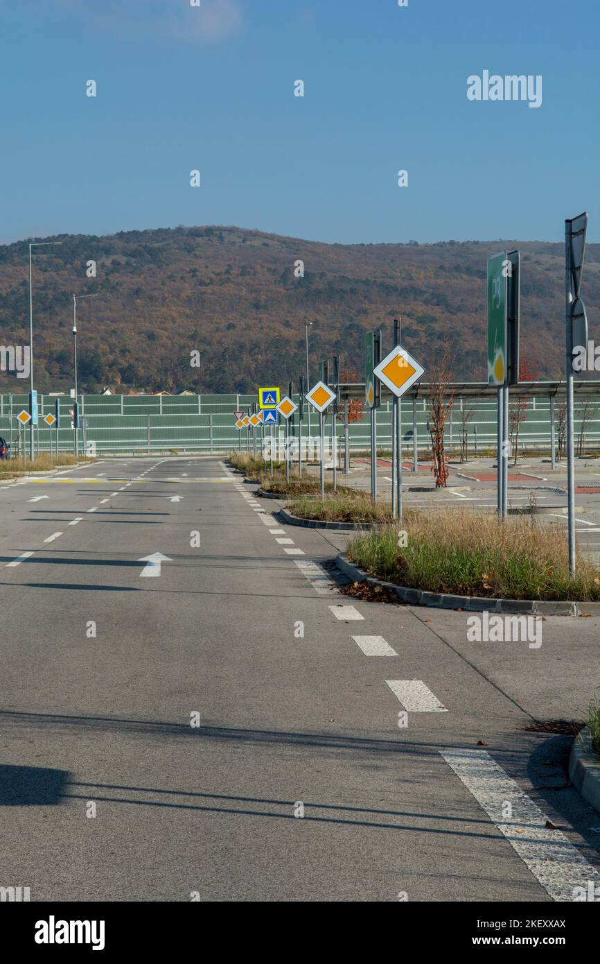 International road signs 'Main road' or 'Priority road' in a row. Many ...