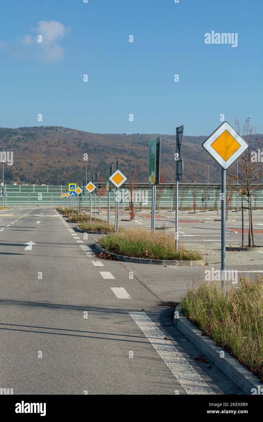 International road signs 'Main road' or 'Priority road' in a row. Many ...
