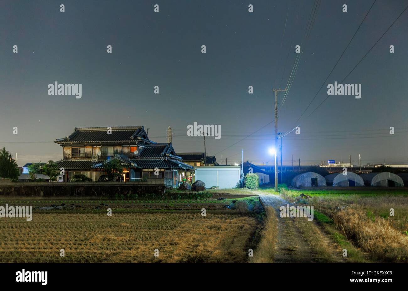 Country road to large Japanese farmhouse at night Stock Photo - Alamy