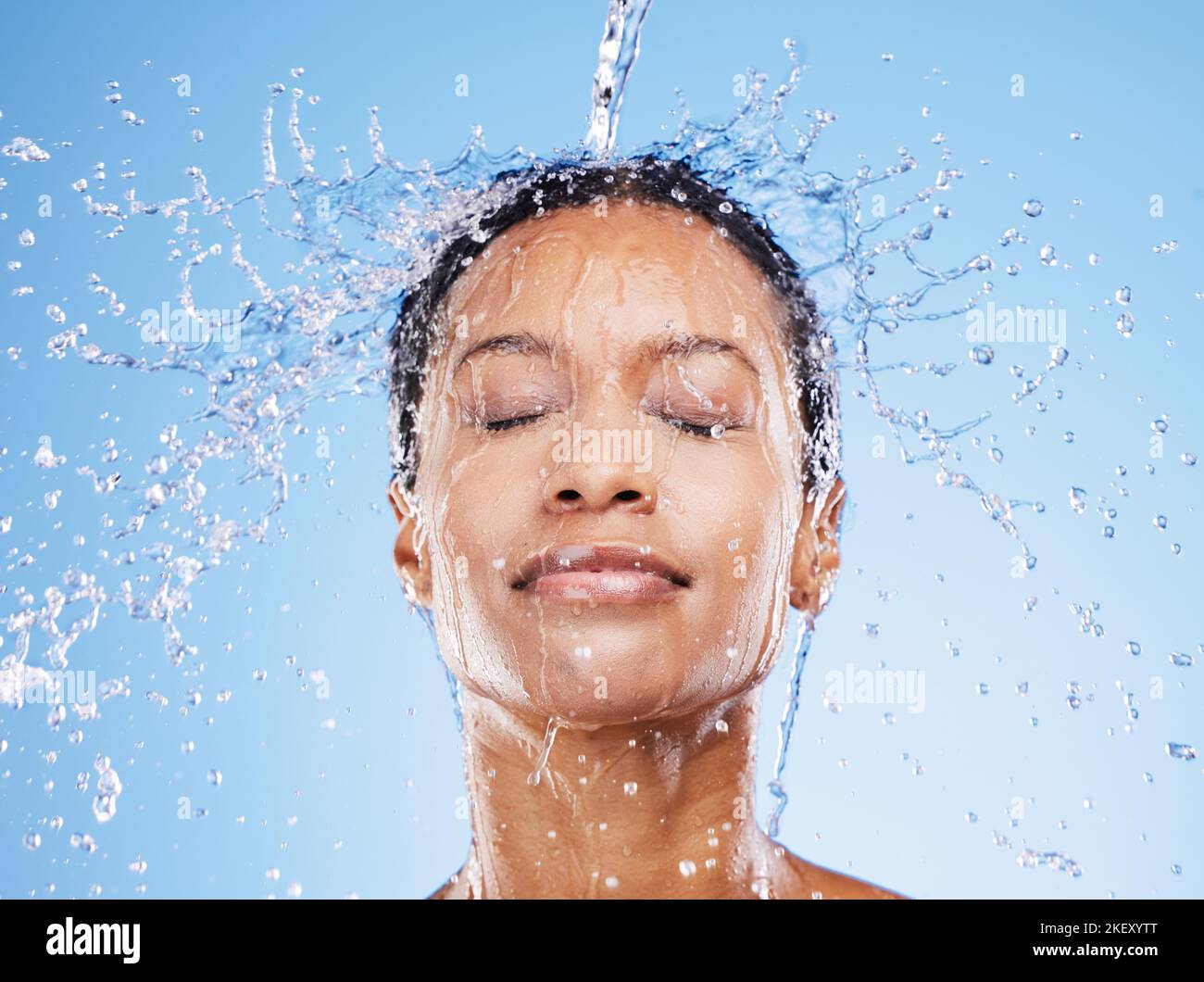 Beauty, water and splash with black woman and shower for hydration, moisture and spa luxury ...