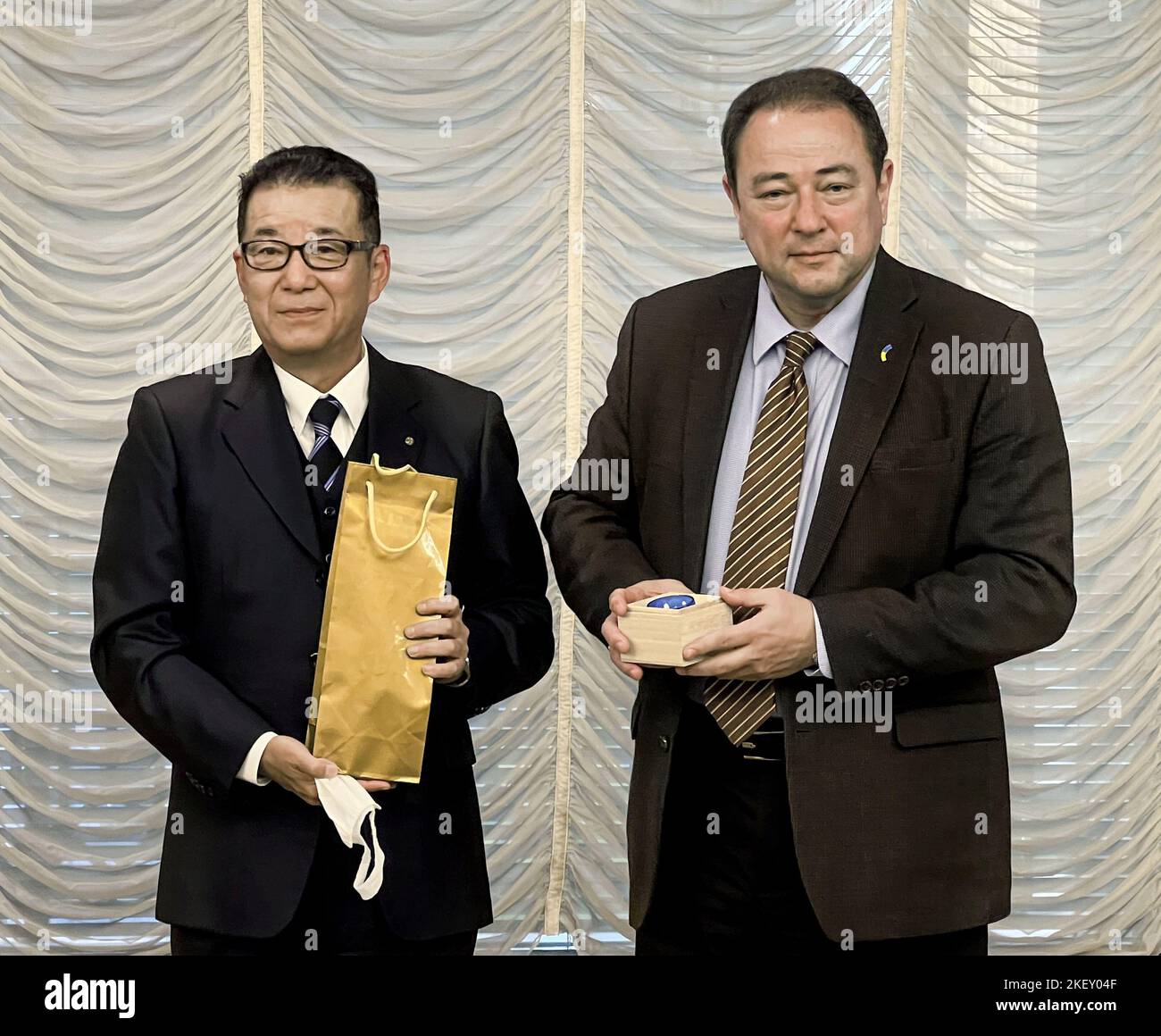 Osaka Mayor Ichiro Matsui (L) and Ukrainian Ambassador to Japan Sergiy ...