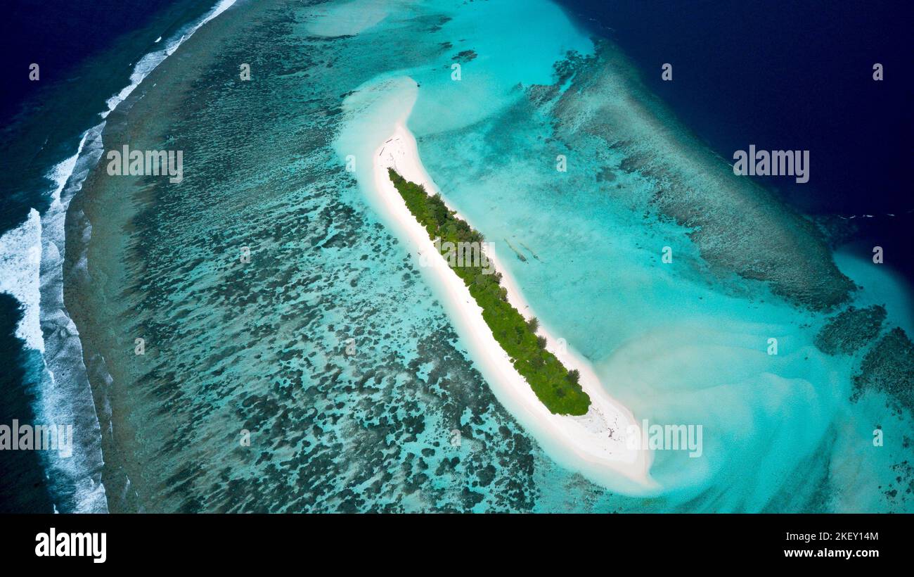 Small coral island Stock Photo - Alamy