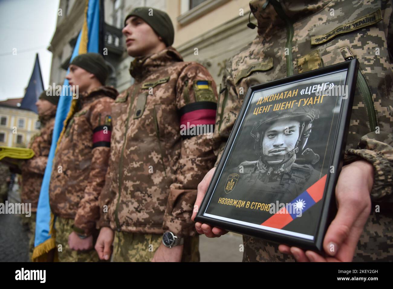 Lviv, Ukraine, 14/11/2022, A soldier holds a portrait of Tseng Sheng ...