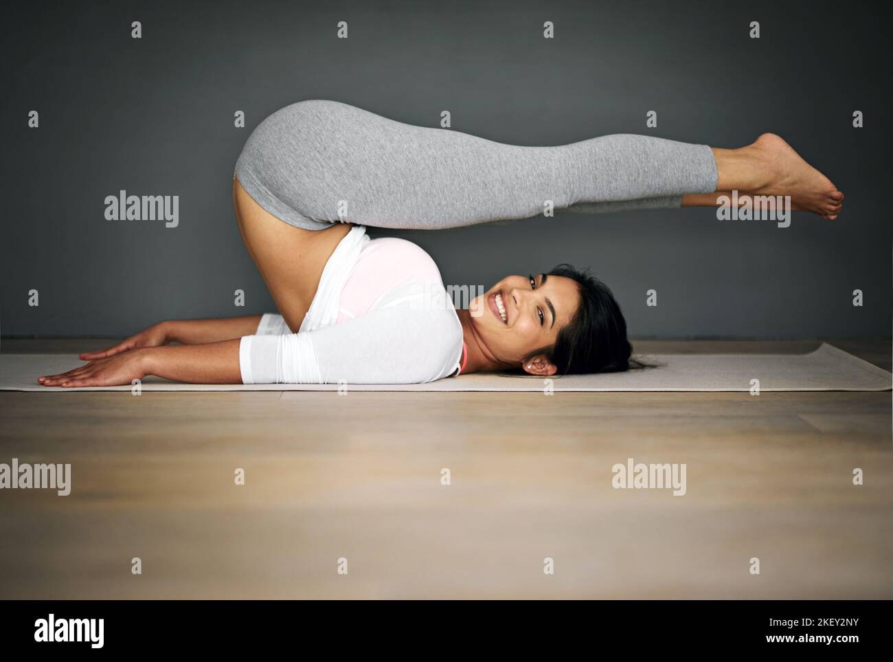 Balance meets flexibility. Portrait of a flexible young woman doing ...