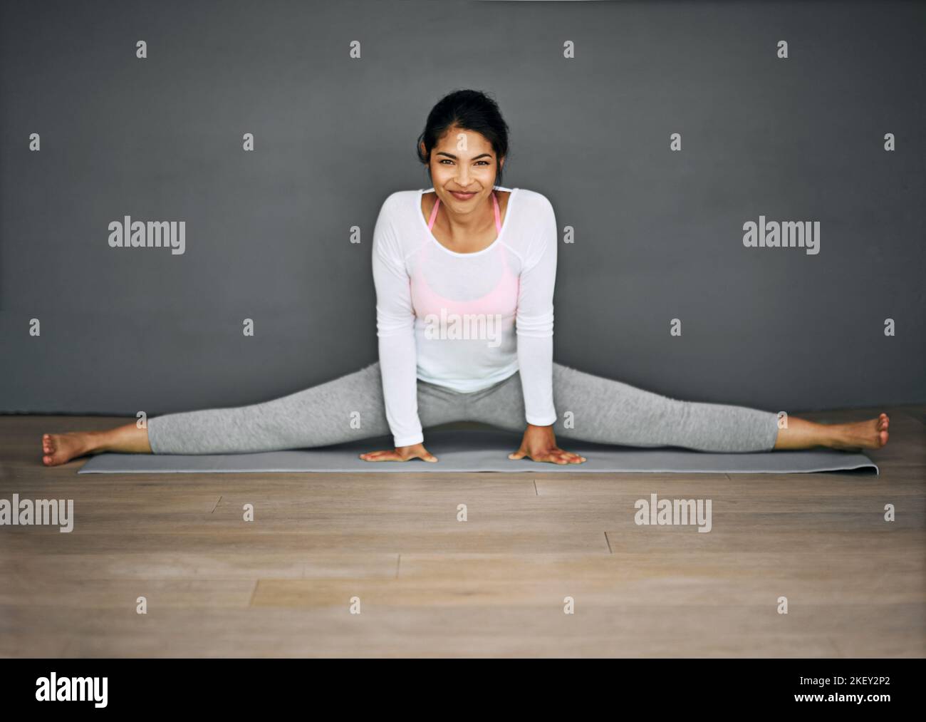 Enhancing her flexibility with yoga. Portrait of an attractive young ...