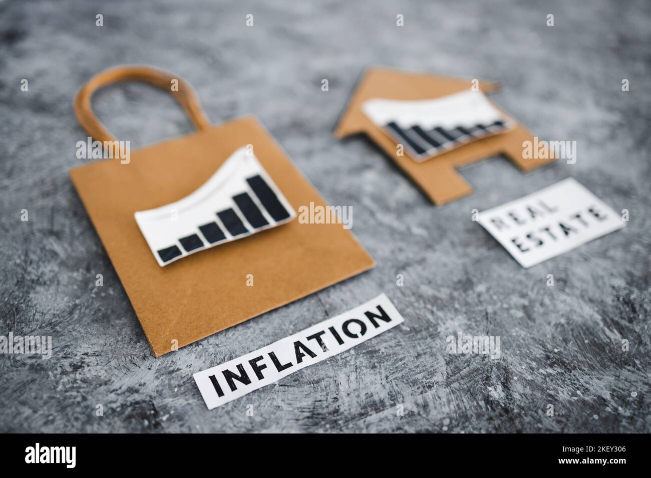 inflation going up and real estate value dropping conceptual image ...