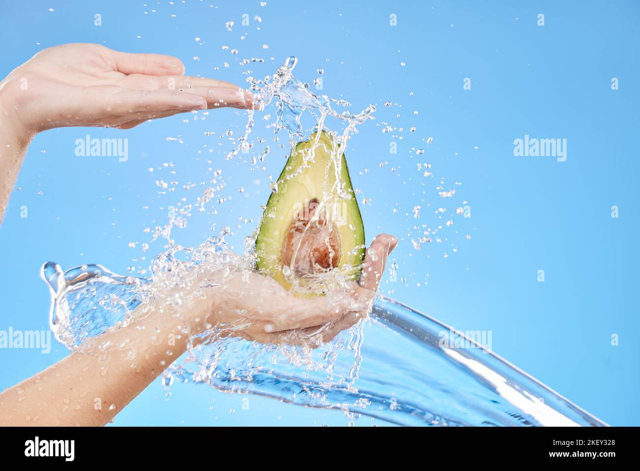 Woman hands washing avocado in hi-res stock photography and images - Alamy