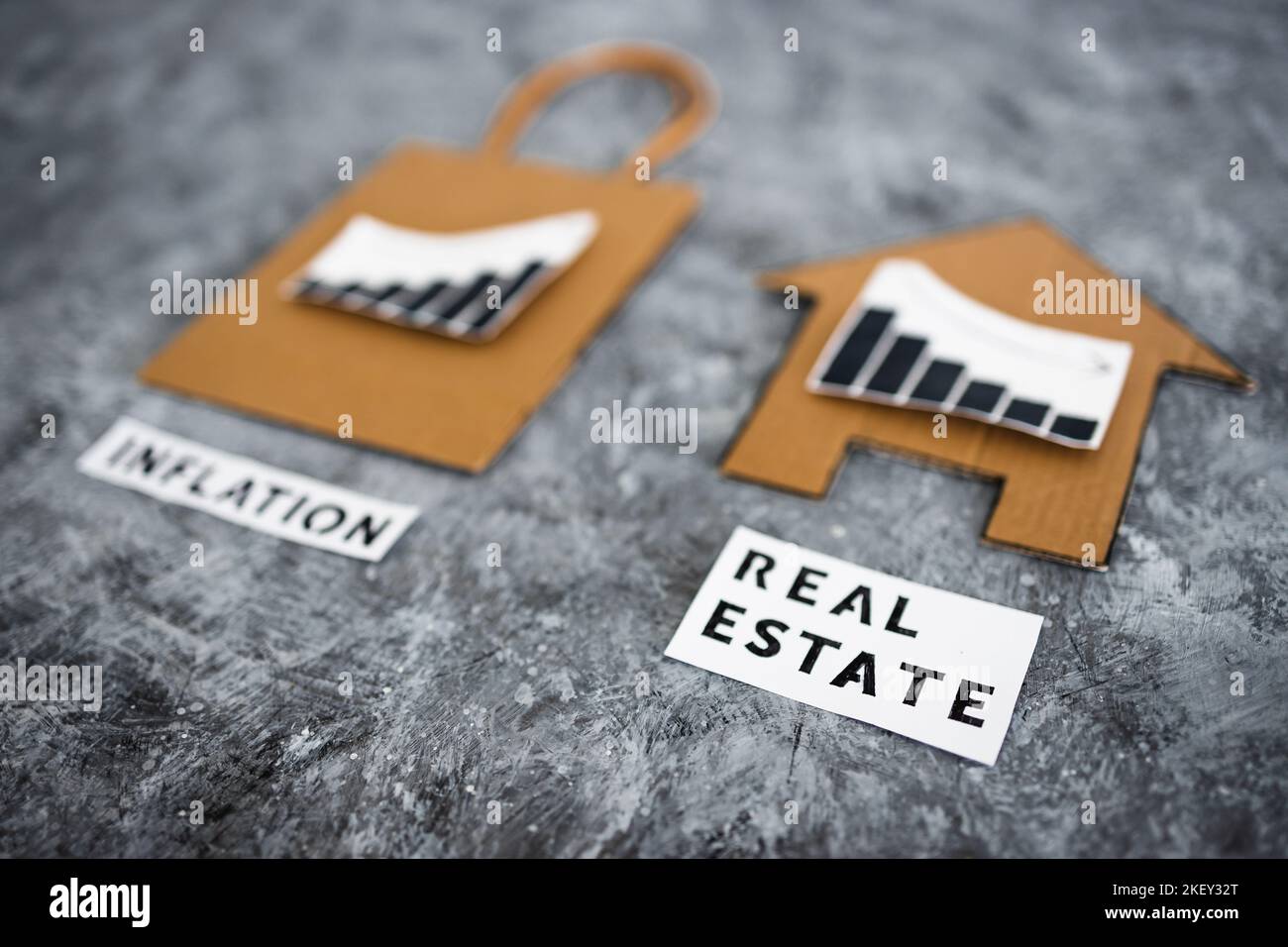 inflation going up and real estate value dropping conceptual image ...