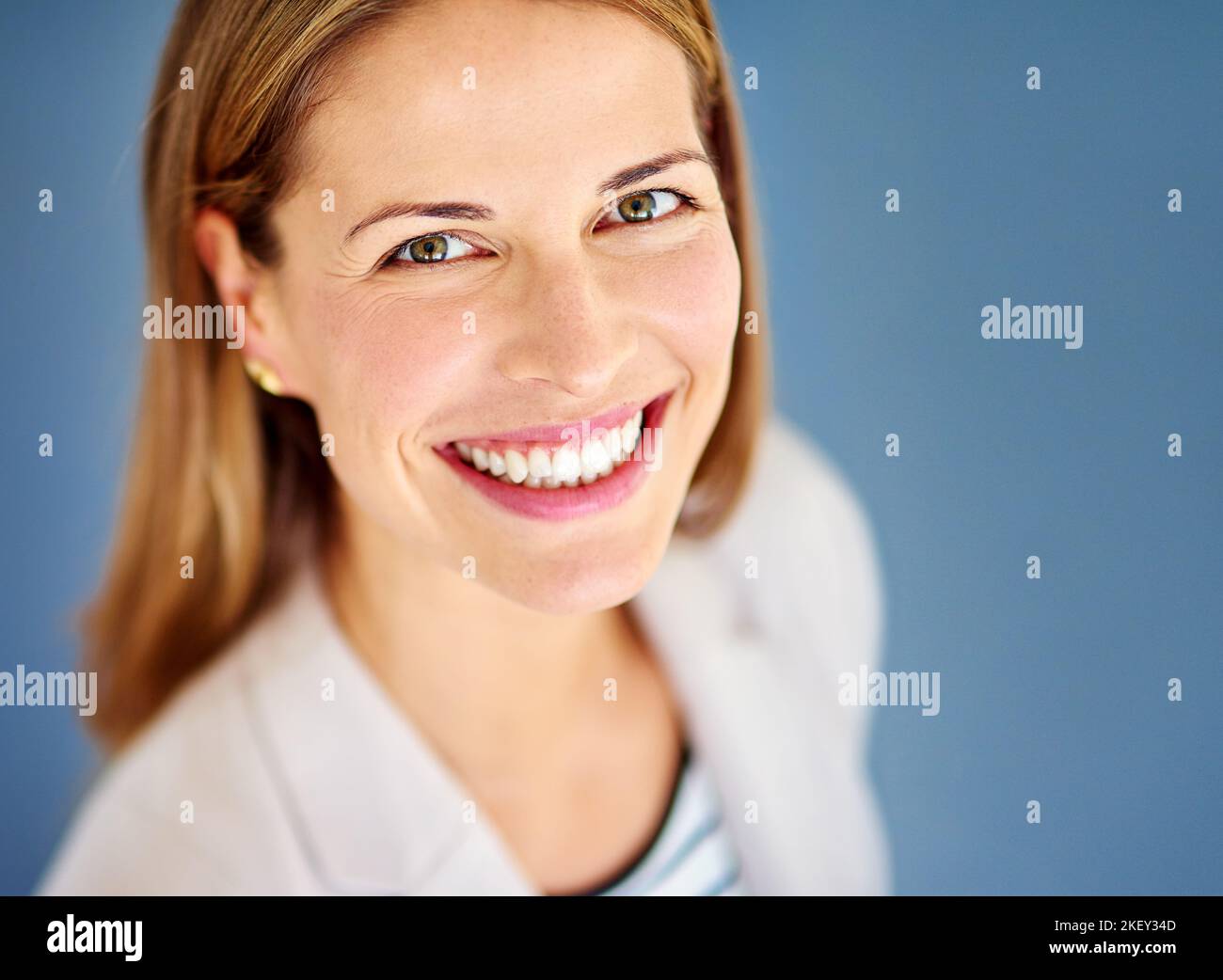 Confidence is the key to success. a woman dressed in office-wear posing ...