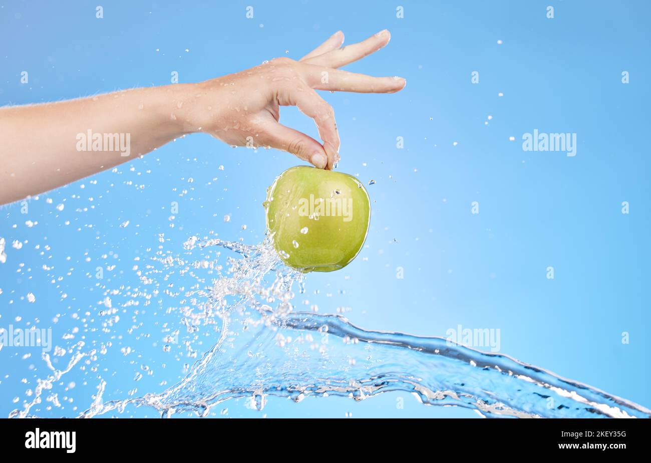 Apple, water splash and hands of health woman with organic product for ...