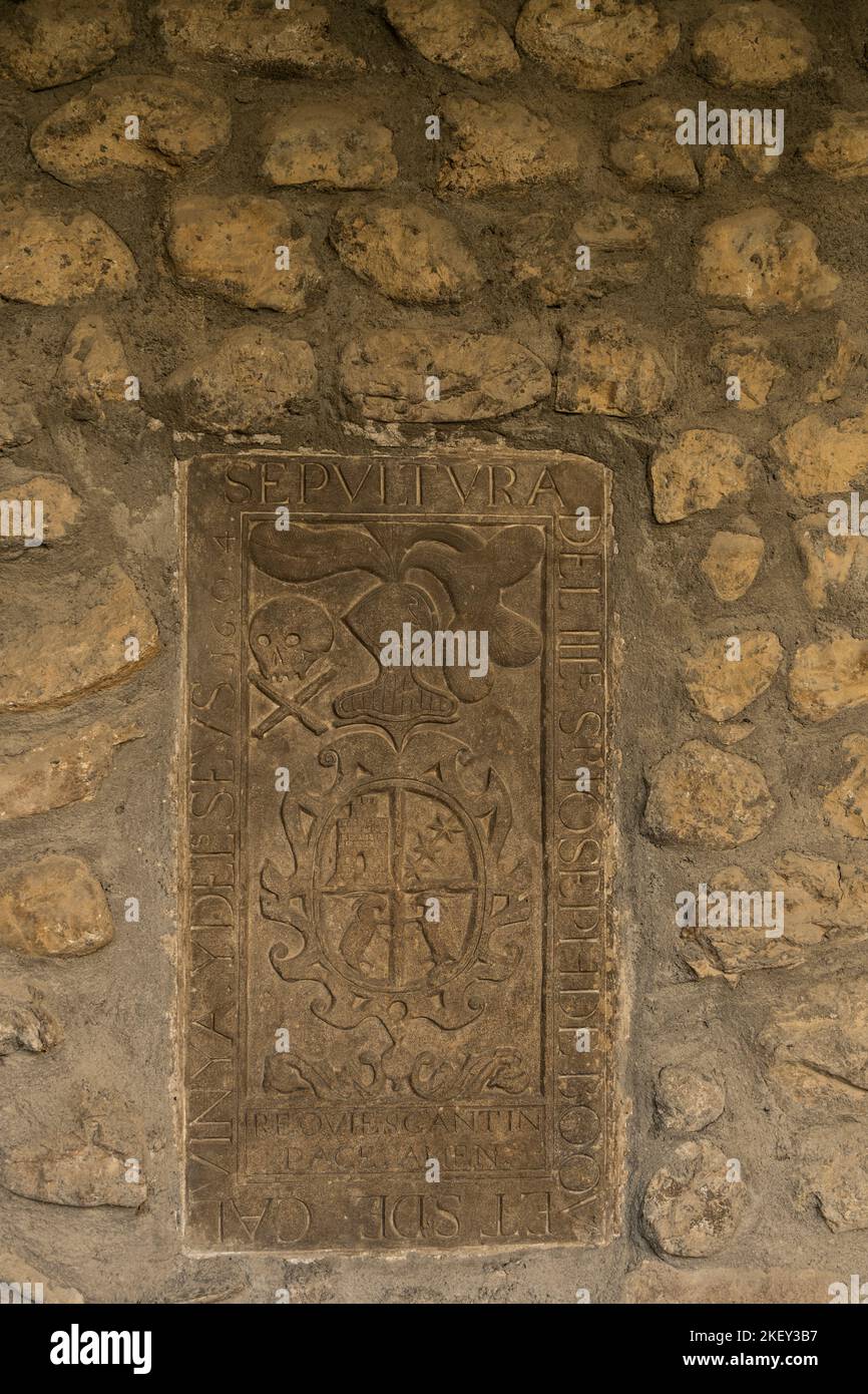 Old Gravestone on the wall of the cloister. La Seu d'Urgell Cathedral ...