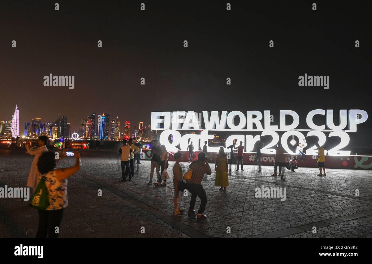 Doha, Qatar. 14th Nov, 2022. People take photos with a FIFA World Cup ...