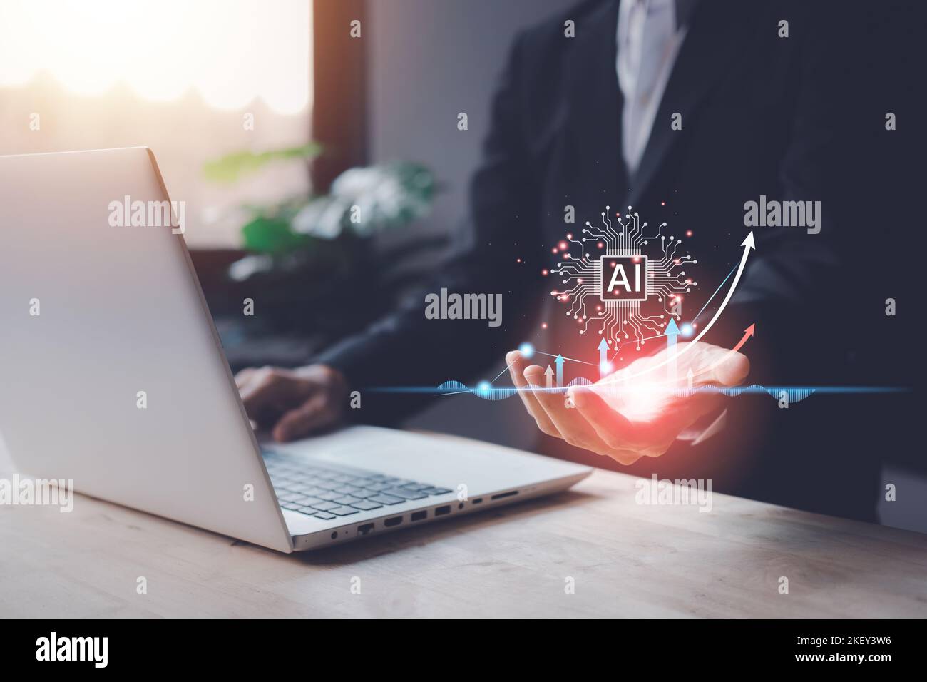 AI (Artificial intelligence) growing concept. Businessman hand typing ...