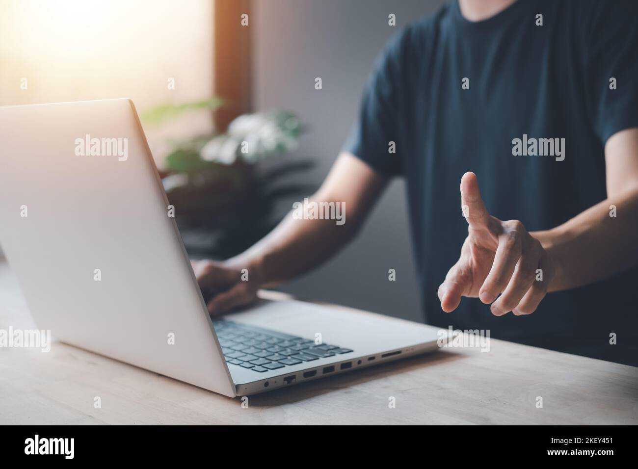 Businessman hand touch and typing notebook (Laptop). Customer service ...