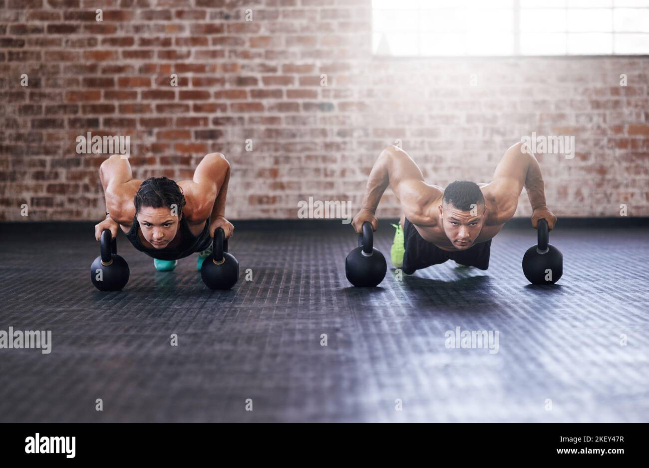 Pushing each other further. Full length shot of two young athletes ...